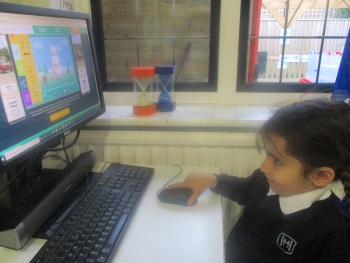Nursery work on their computer skills